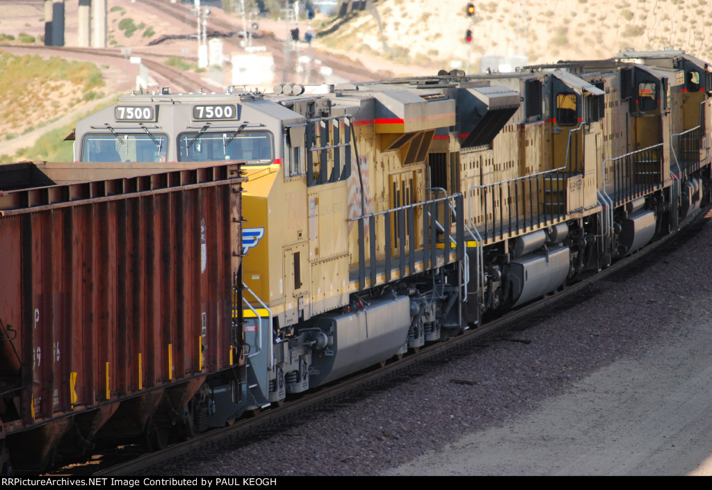 UP 7500 passes me by as you see the Yellow over a Red light for the siganl and the engineer in ...